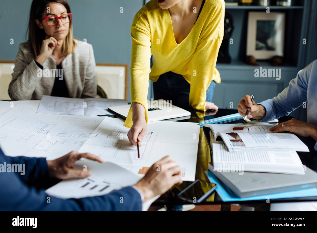 Architects having a meeting, discussing a project Stock Photo - Alamy