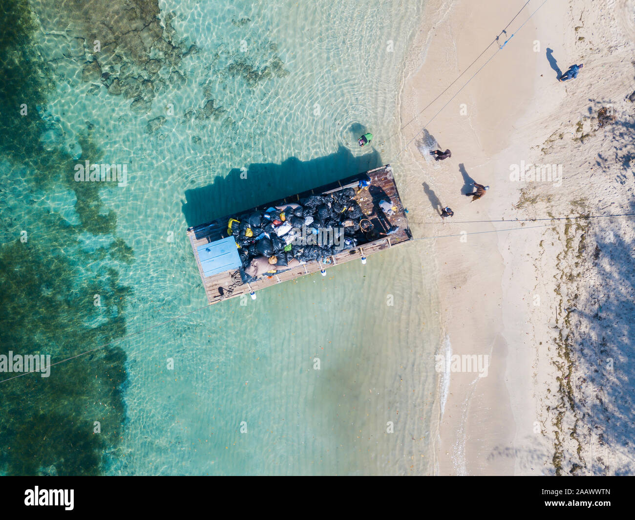 Aerial view of pontoon transporting garbage at Gili Islands, Bali ...