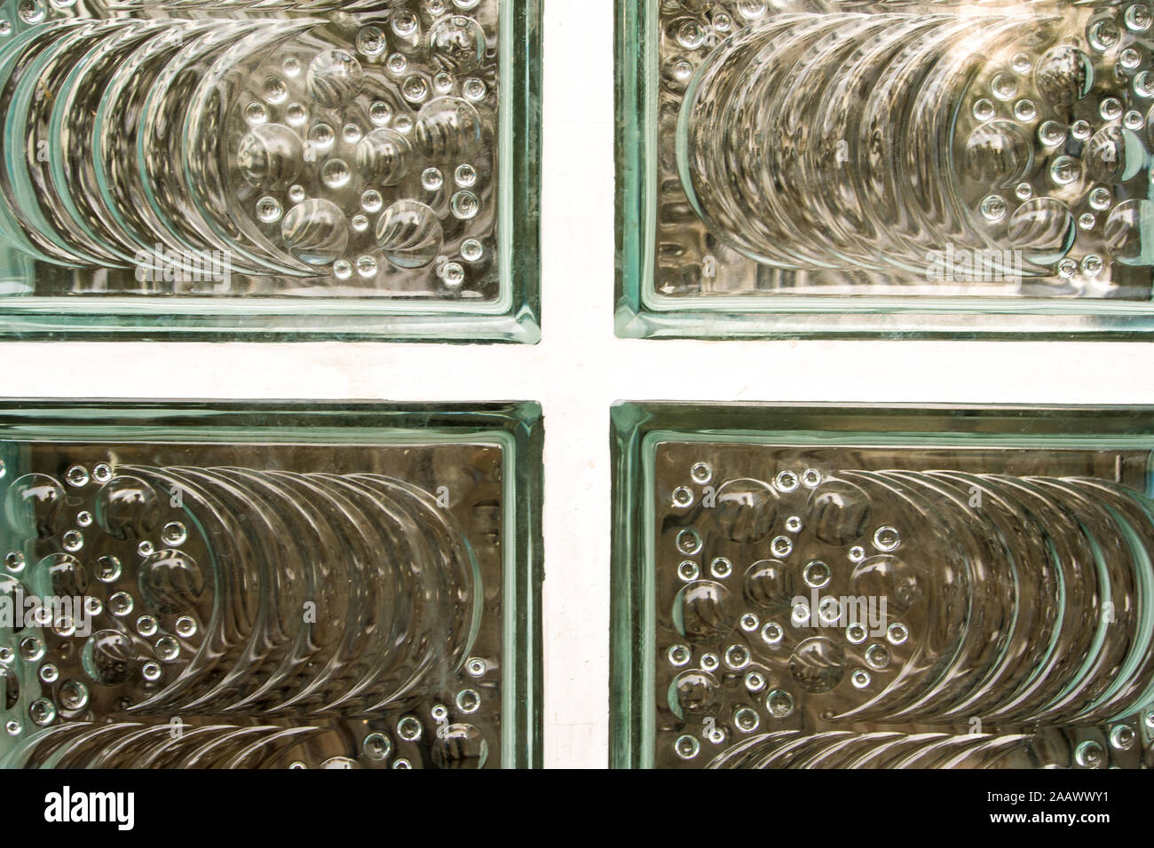 The joints of four glass blocks Stock Photo - Alamy