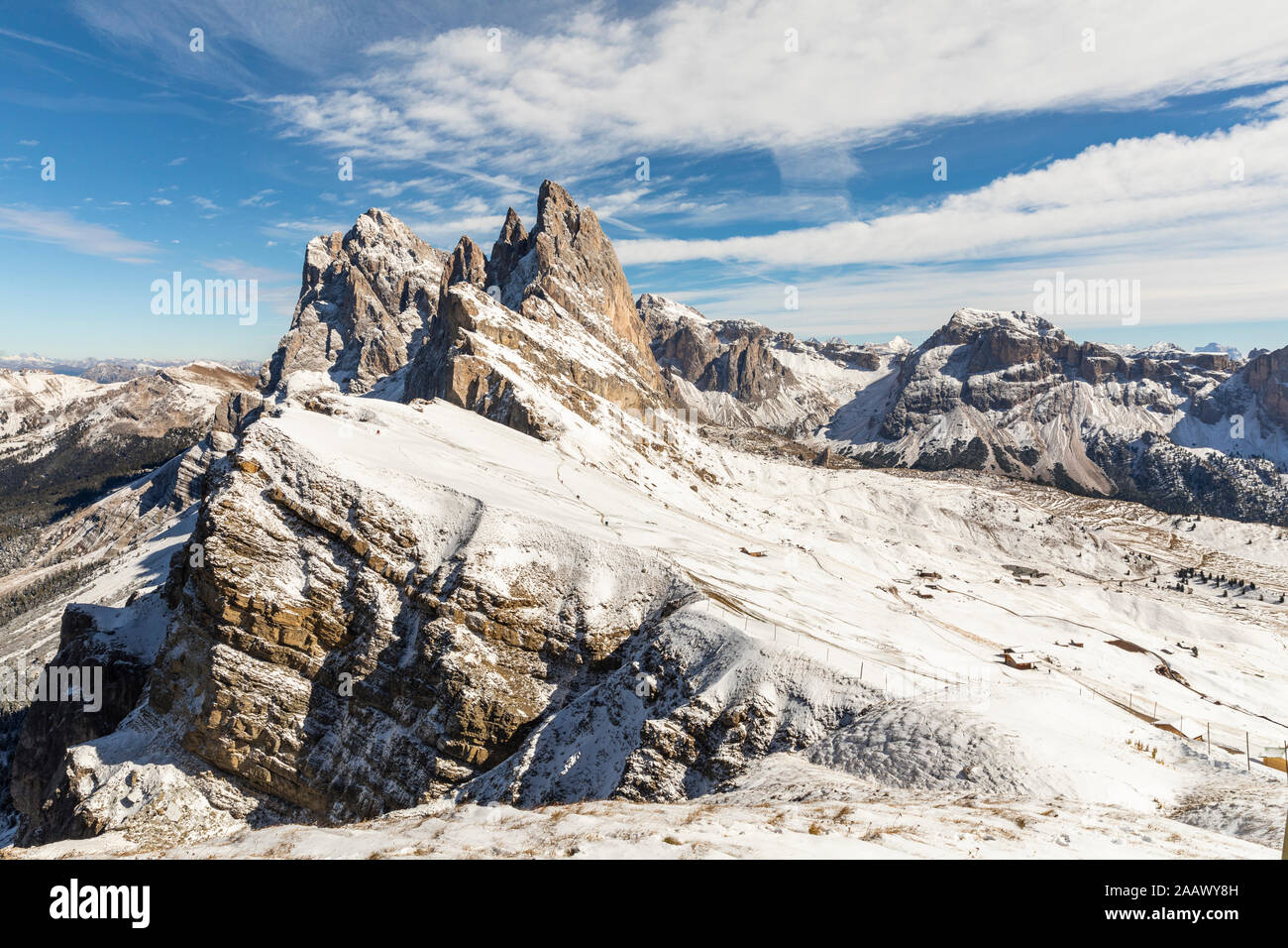 Scenic view of Seceda peak and mountains against sky during winter ...