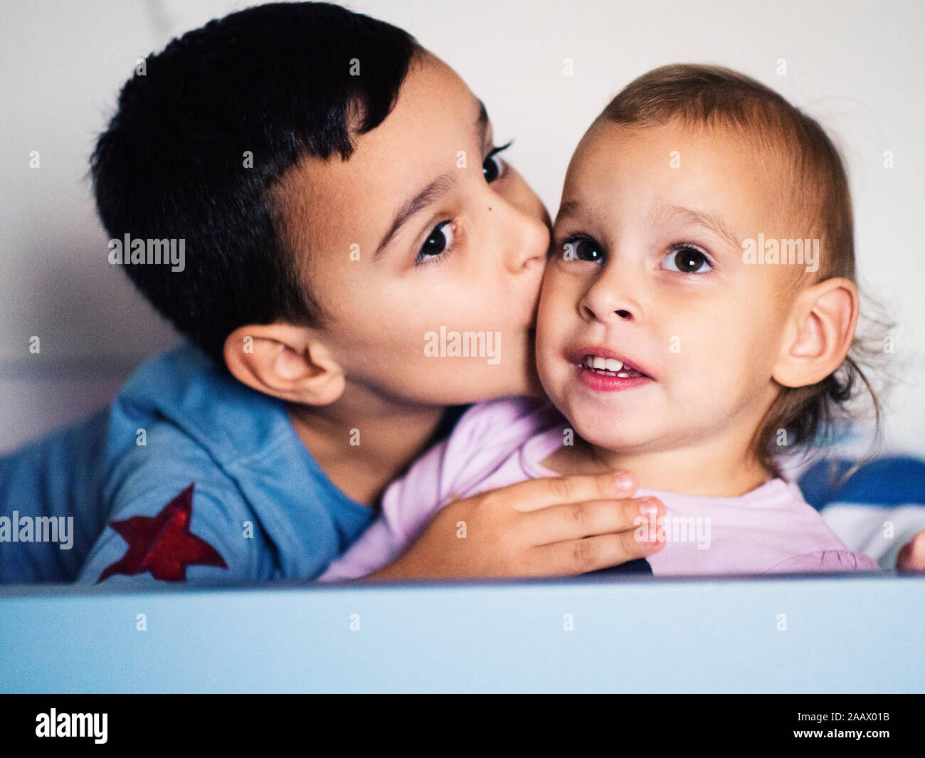 brother kissing his little sister Stock Photo - Alamy