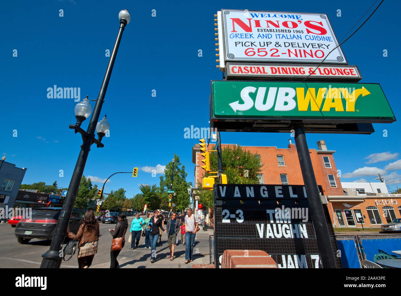 Signs and people in Broadway Avenue, Saskatoon, Saskatchewan, Canada ...