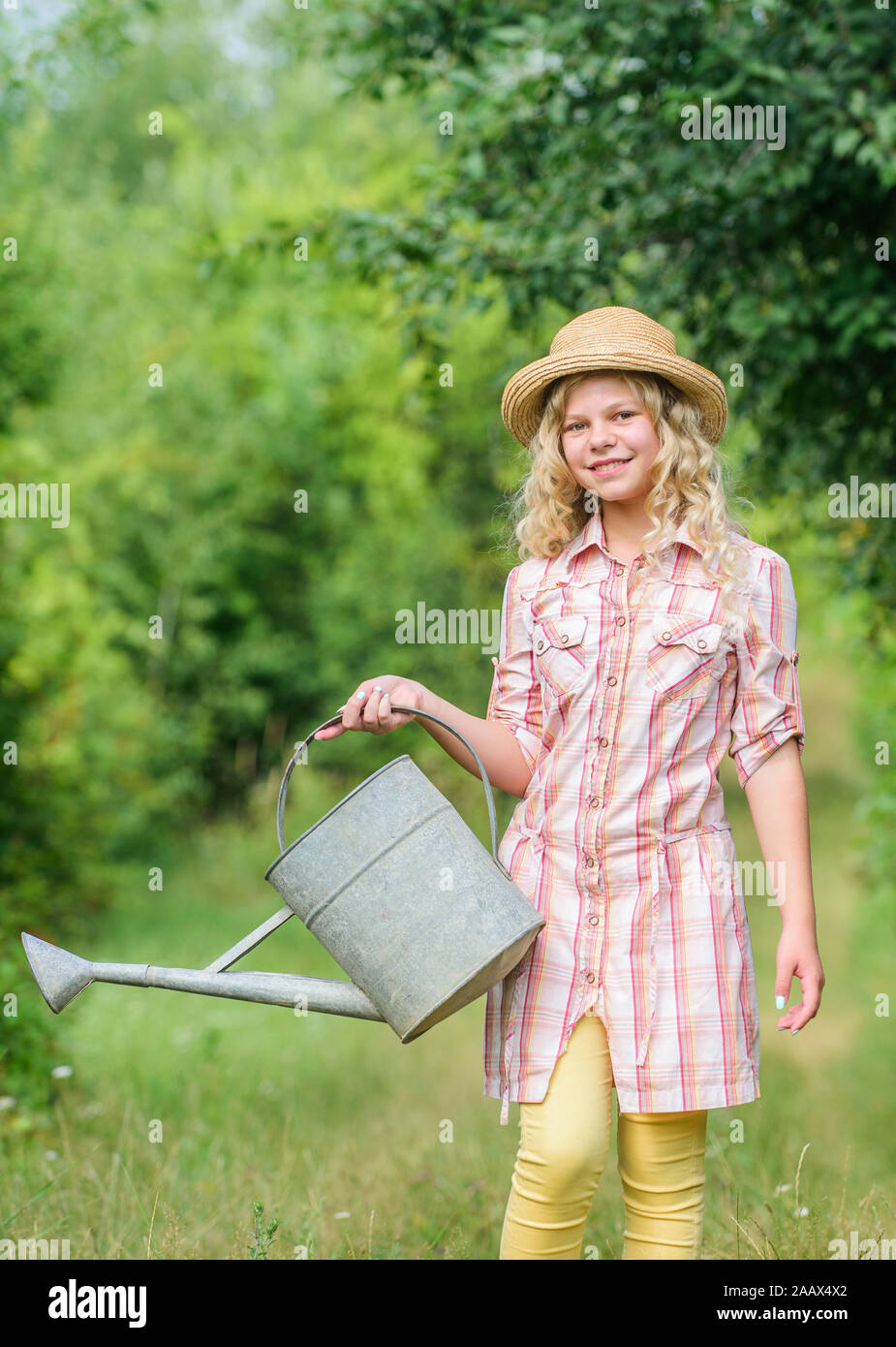 Watering tools. Girl child hold watering can. Spring gardening ...
