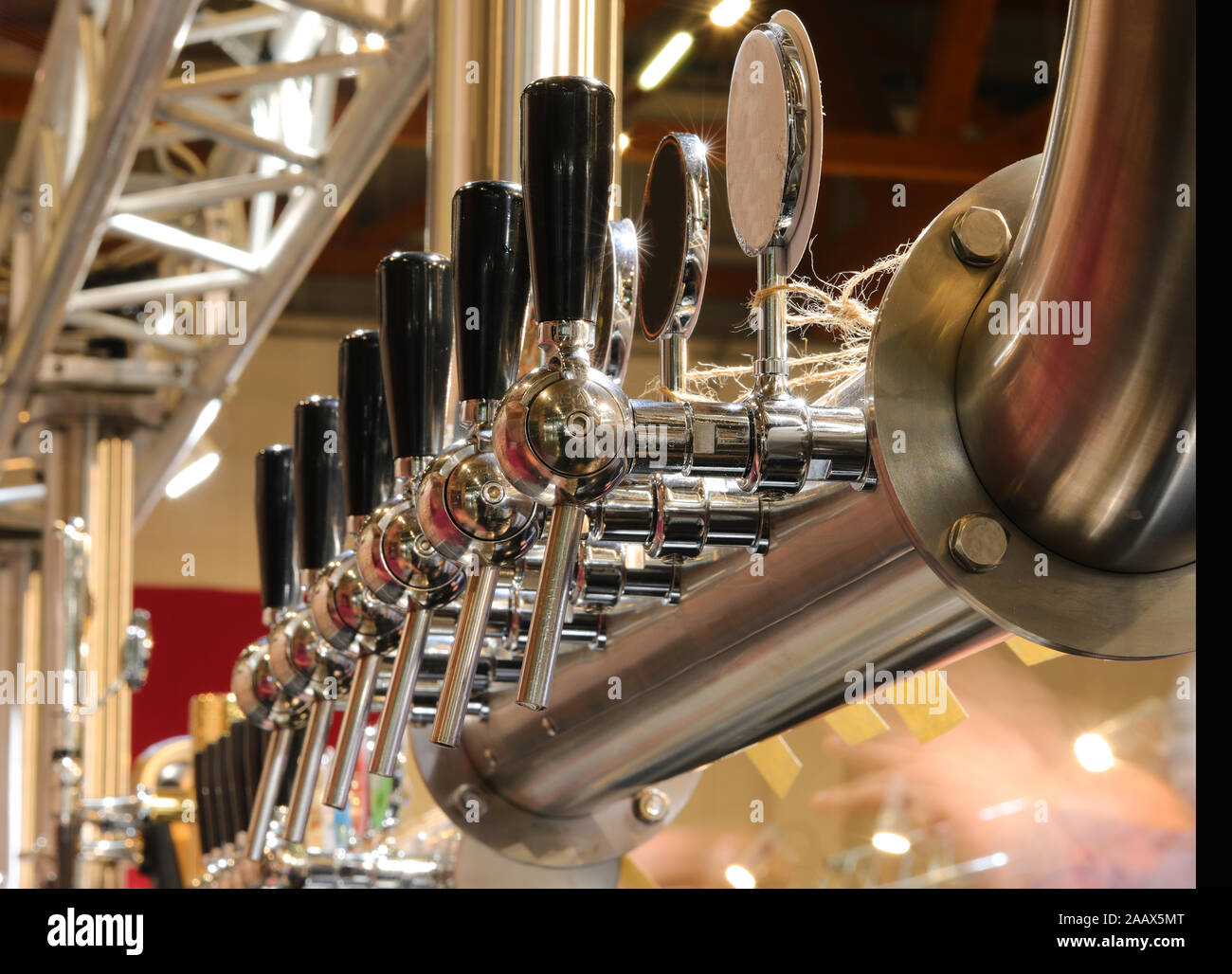 Array of taps for draught beer in the pub with long exposure technique ...
