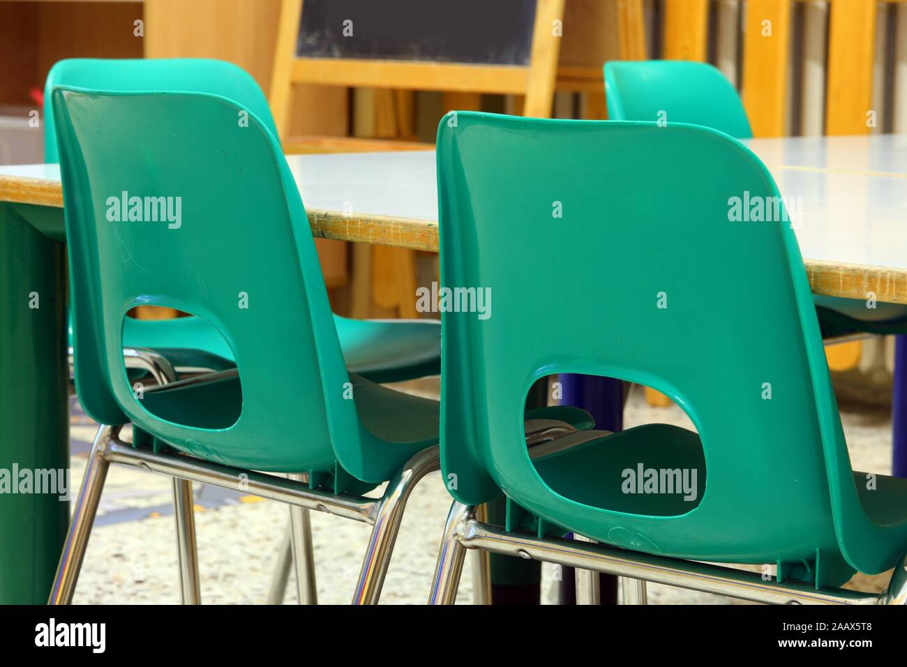 green small chairs in the classroom of the school Stock Photo - Alamy