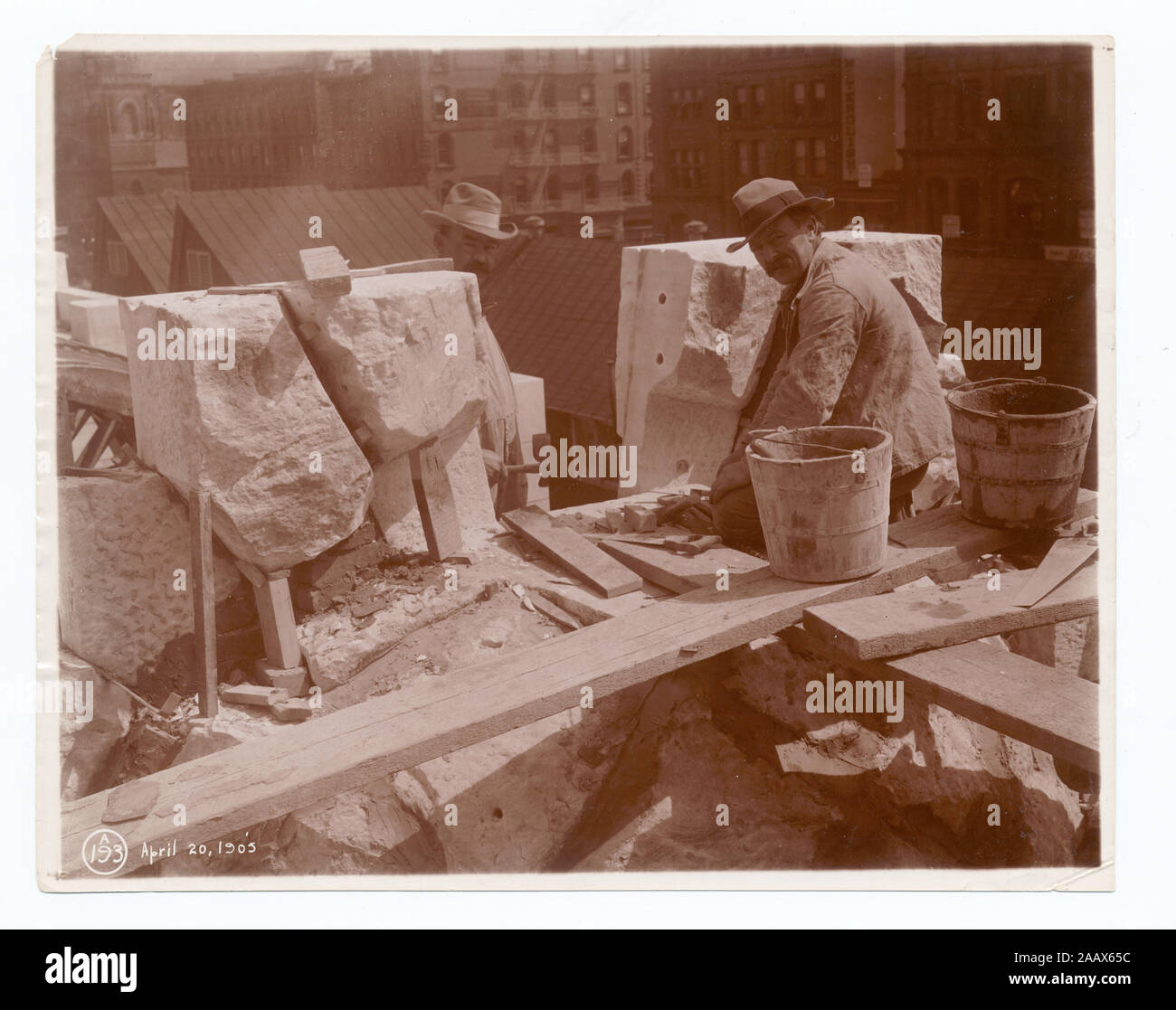 Exterior marble work - two workers Exterior marble work : two workers ...