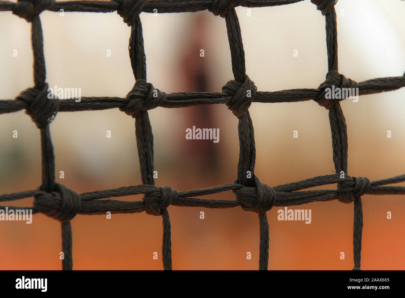 Tennis red court with gray net Stock Photo - Alamy