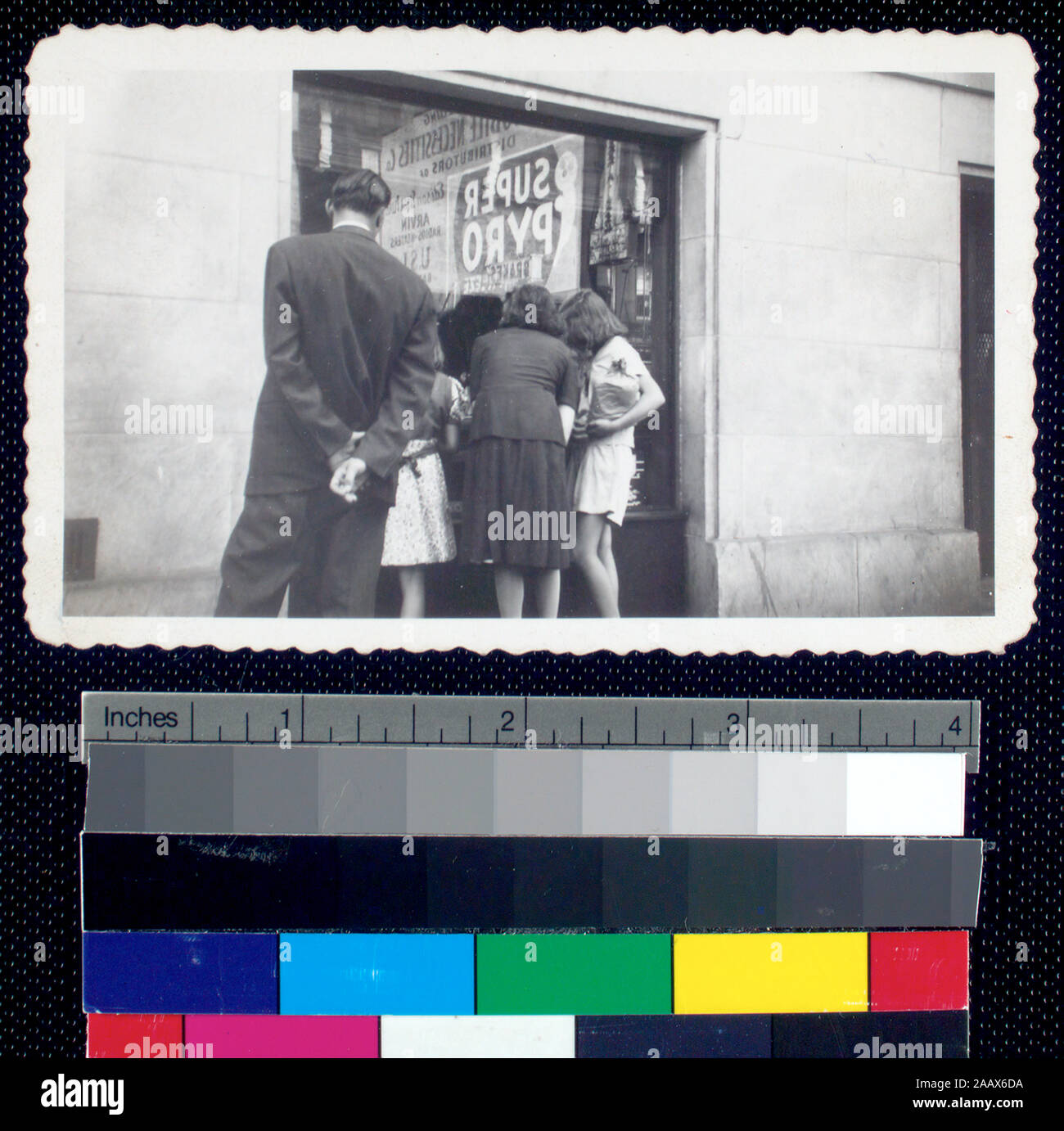 Exterior, people looking in at window display Exterior, people looking ...