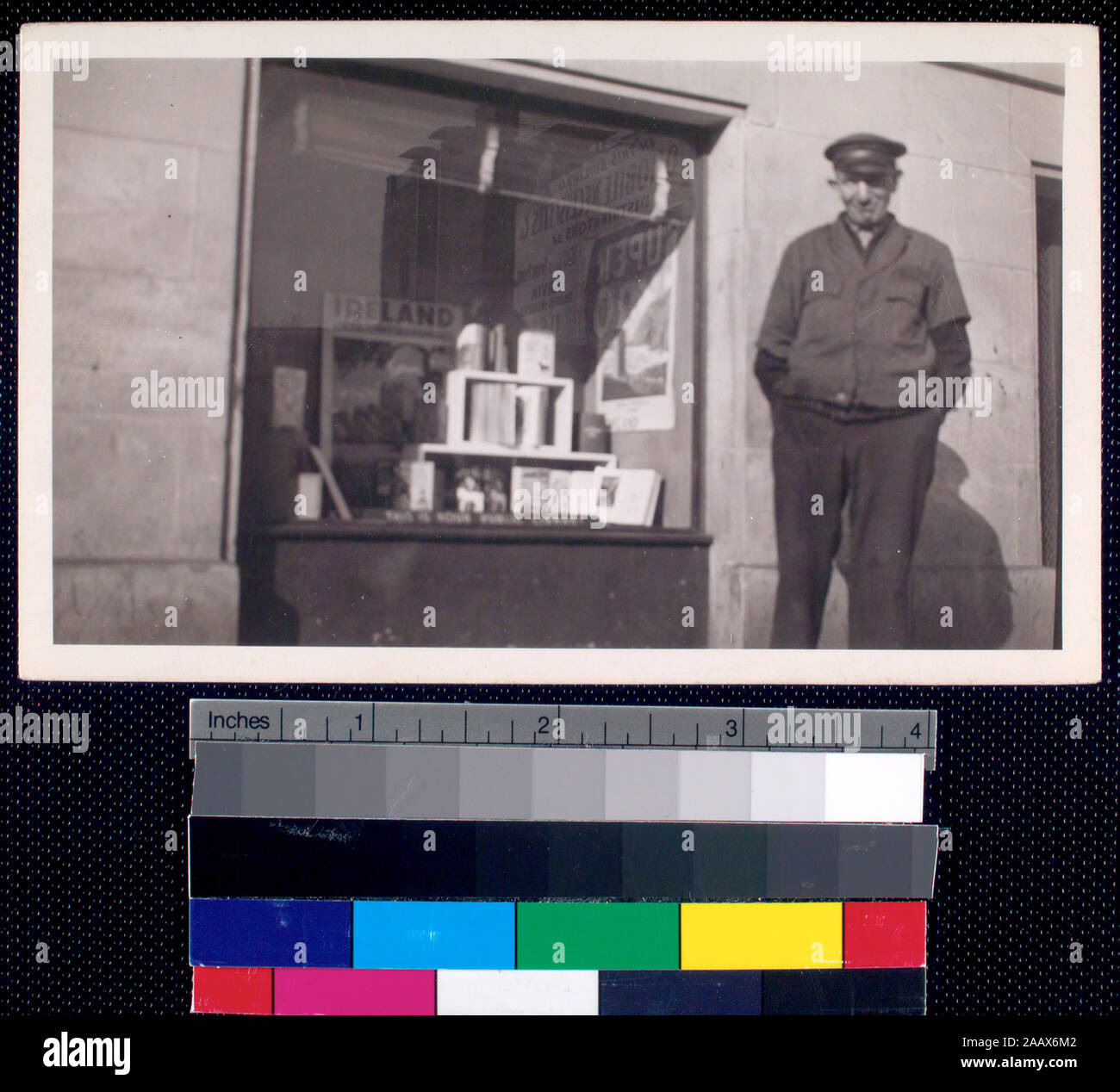 Exterior, window display on Ireland with man standing next to window ...