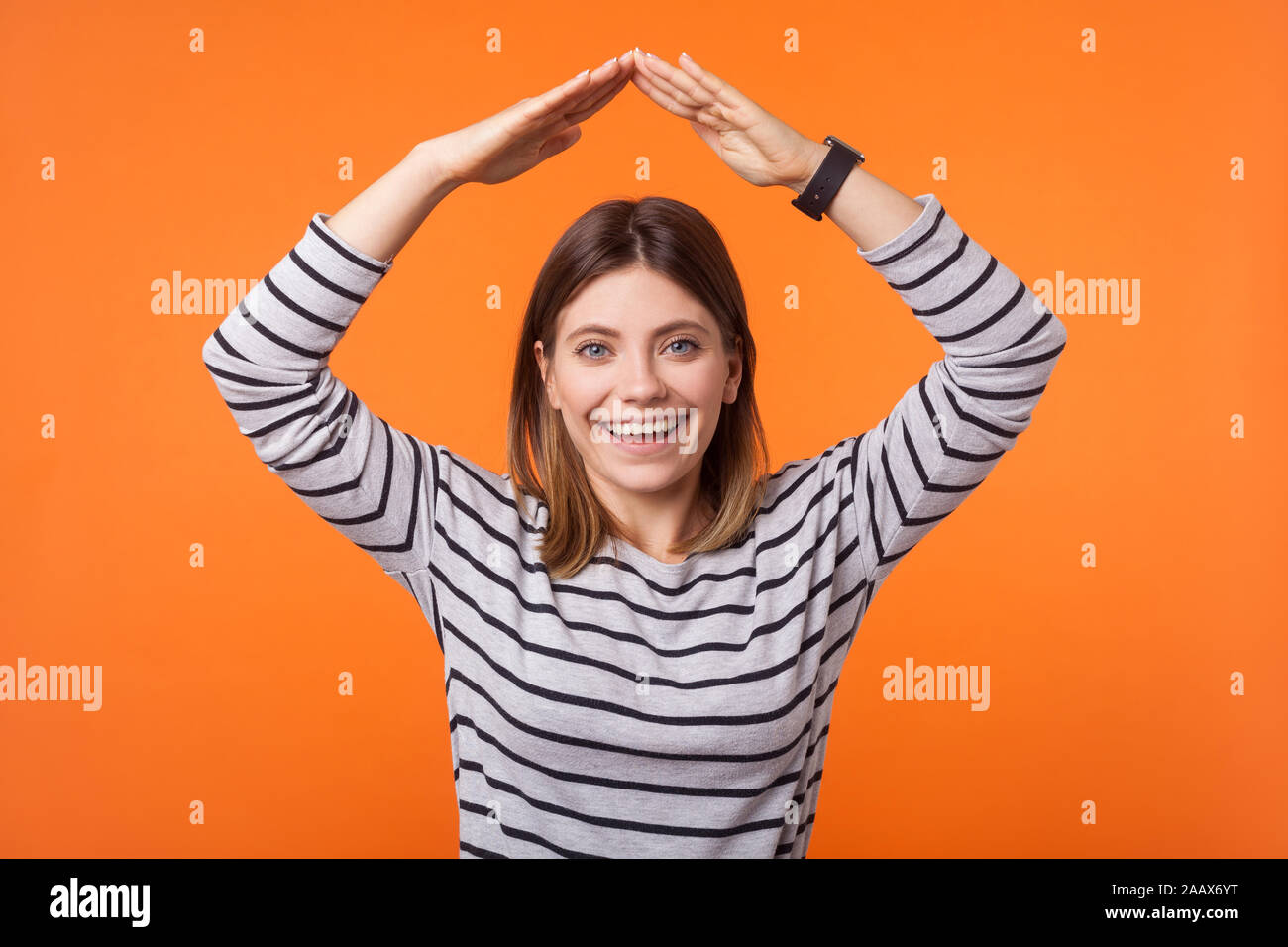 Woman raising hands above head hi-res stock photography and images - Alamy
