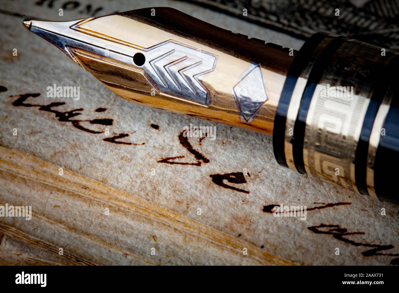 antique fountain pen on the book Stock Photo - Alamy