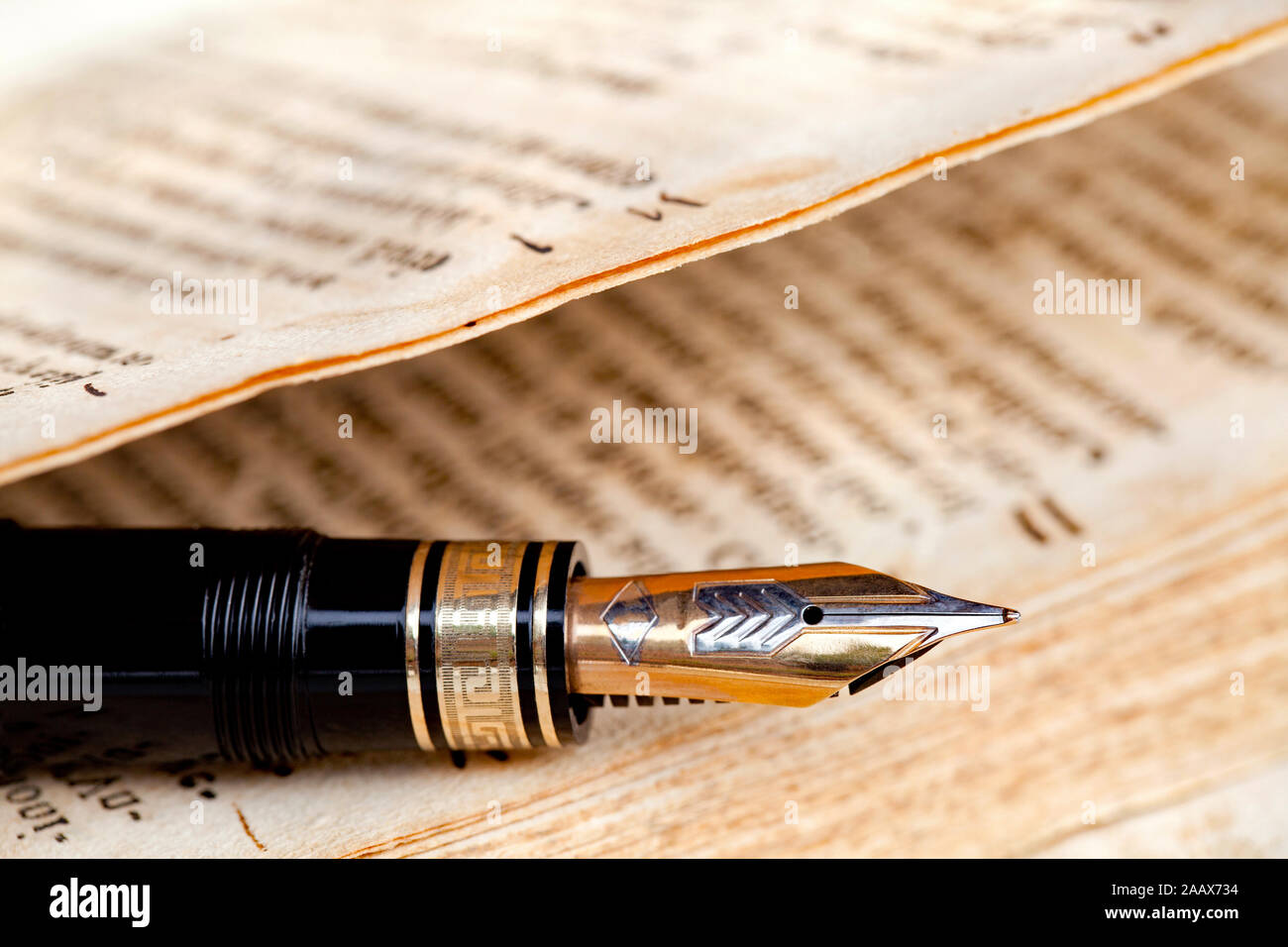 antique fountain pen on the book Stock Photo - Alamy