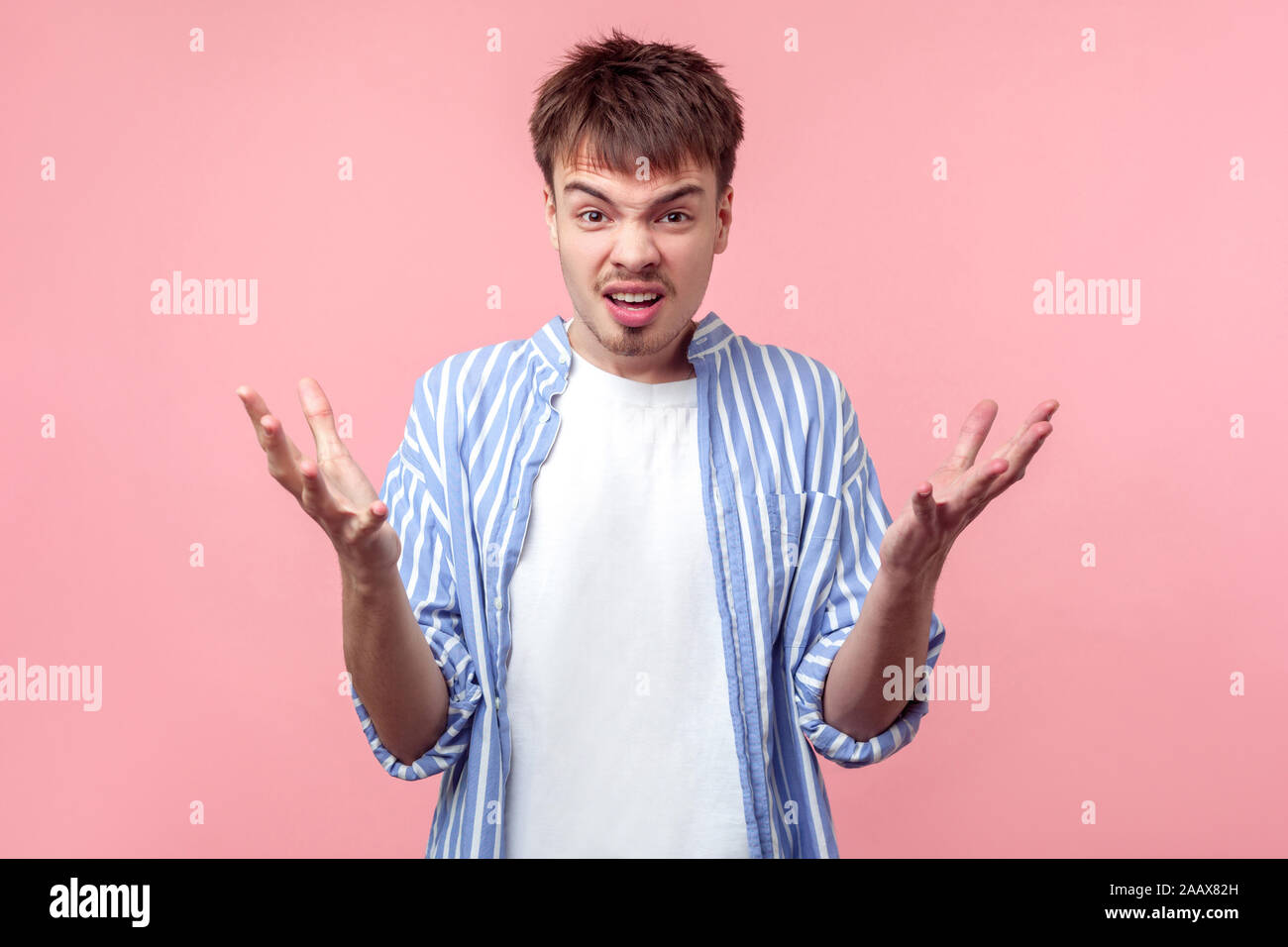 What do you want? Portrait of irritated angry brown-haired man with ...