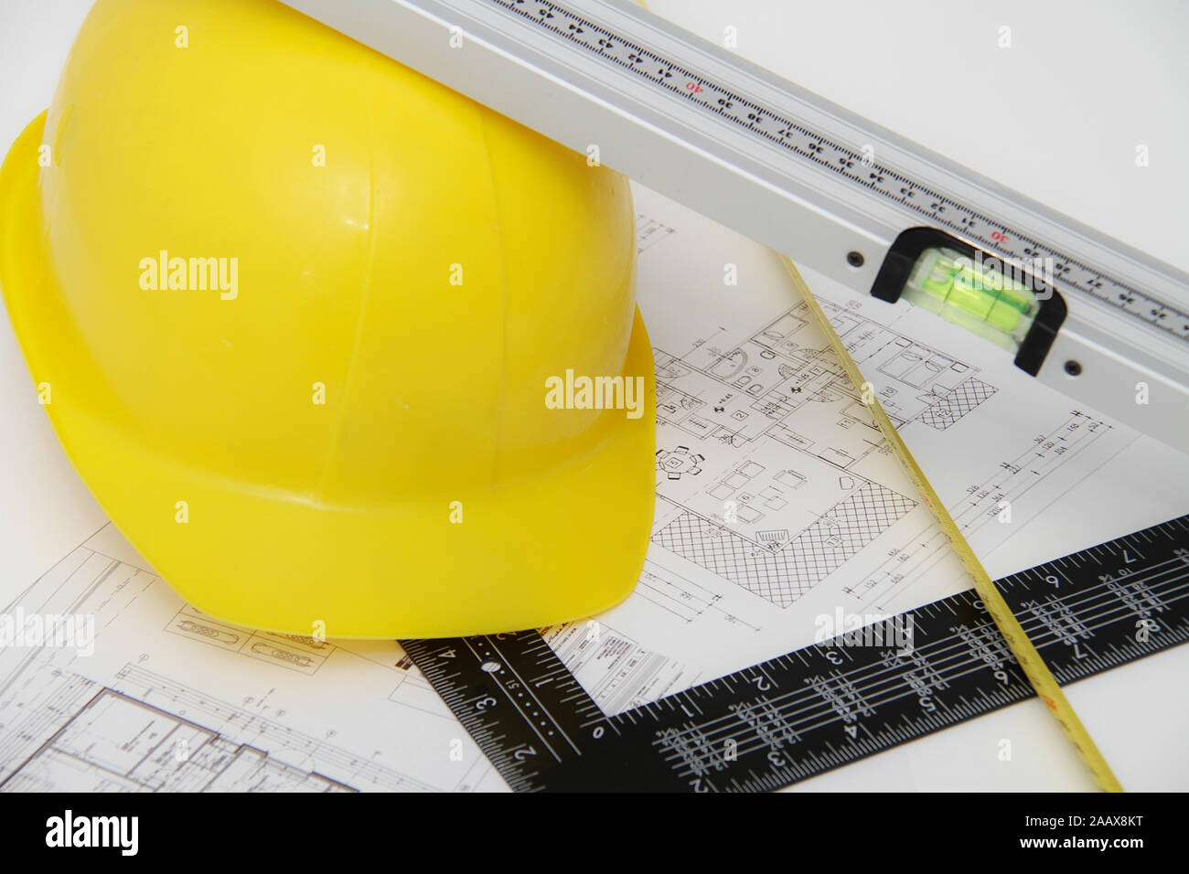 Photo of the Helmet and tools for construction drawings and buildings ...