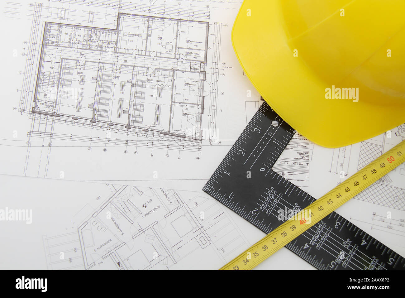 Photo of the Helmet and tools for construction drawings and buildings ...