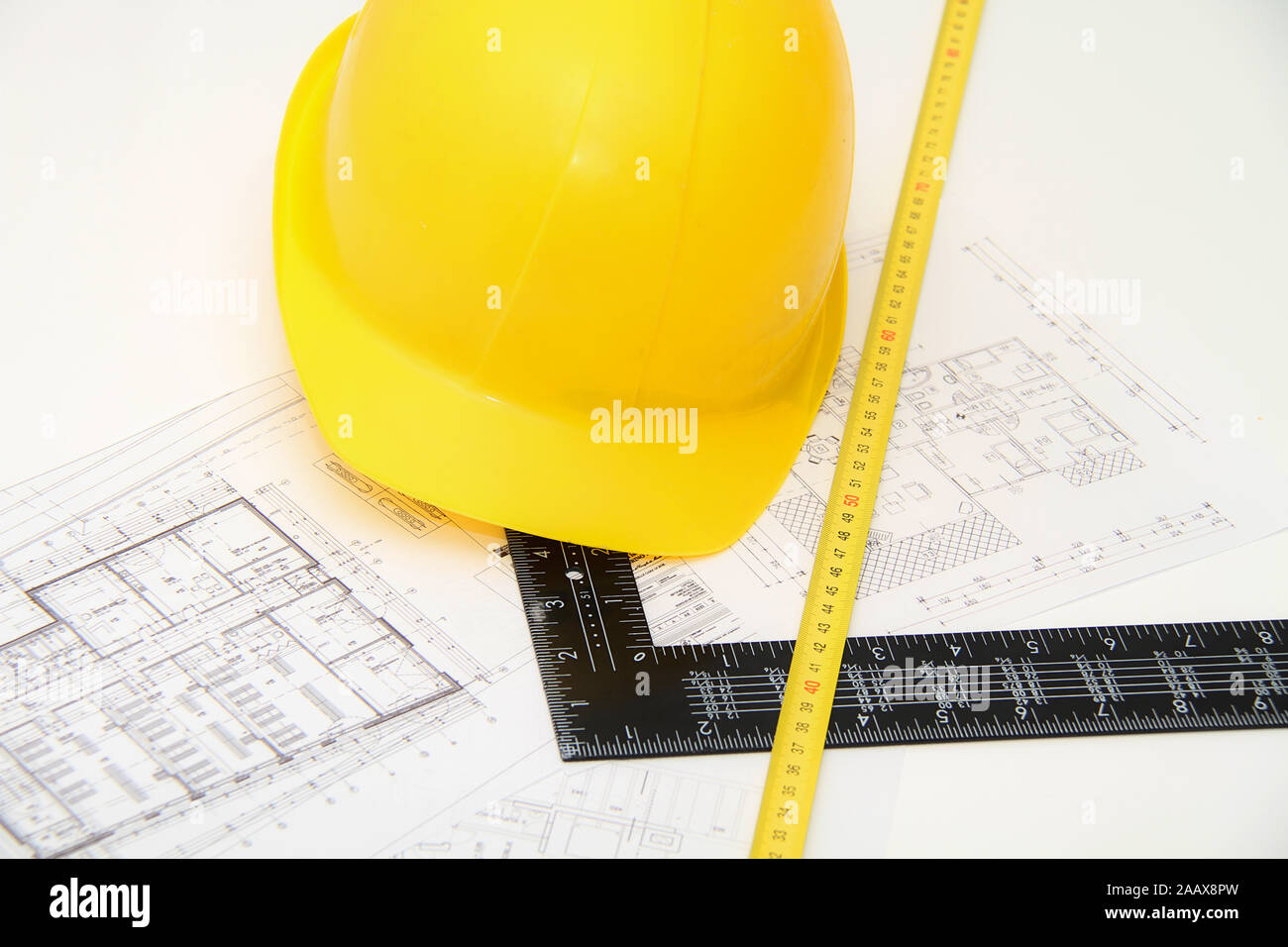 Photo of the Helmet and tools for construction drawings and buildings ...