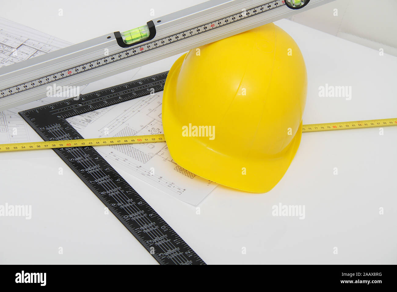 Photo of the Helmet and tools for construction drawings and buildings ...