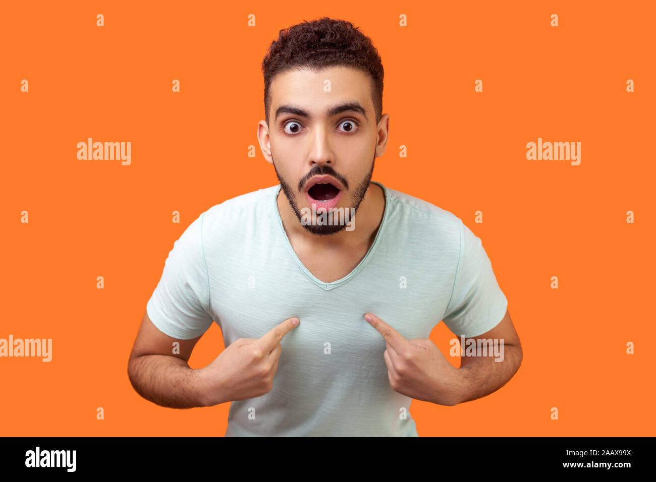 Young latin man staring camera hi-res stock photography and images - Alamy