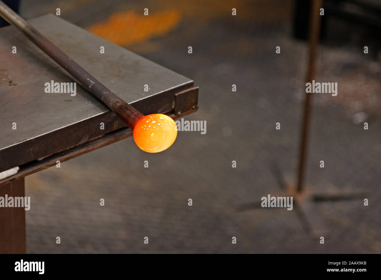 melted hot pulp slowly formed by a glass artist at Roback Stock Photo ...