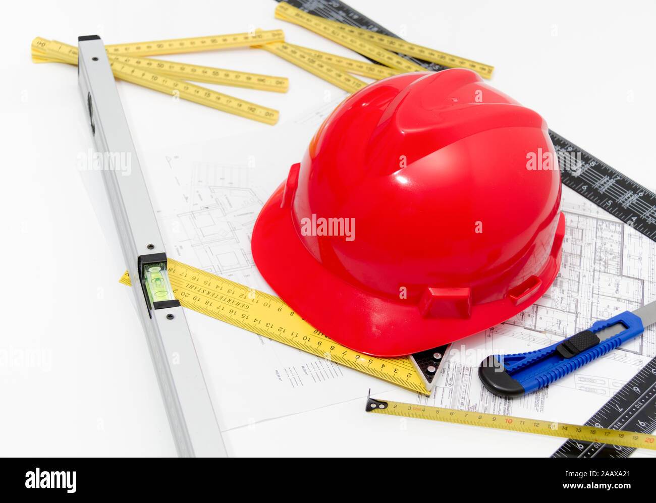 Photo of the Helmet and tools for construction drawings and buildings ...