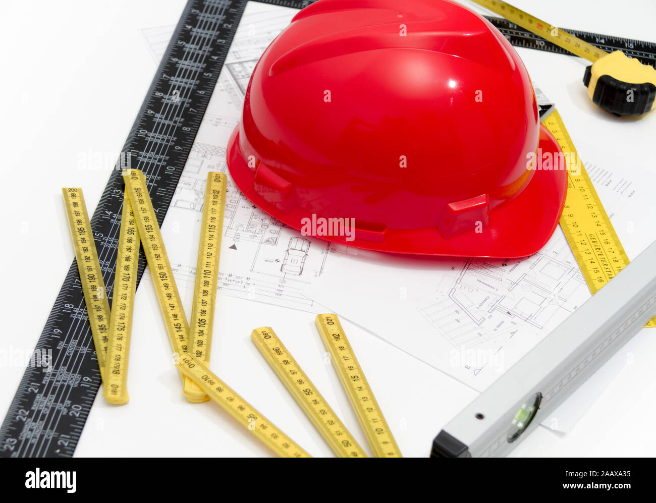 Photo of the Helmet and tools for construction drawings and buildings ...