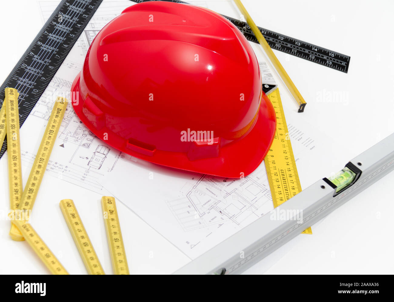 Photo of the Helmet and tools for construction drawings and buildings ...