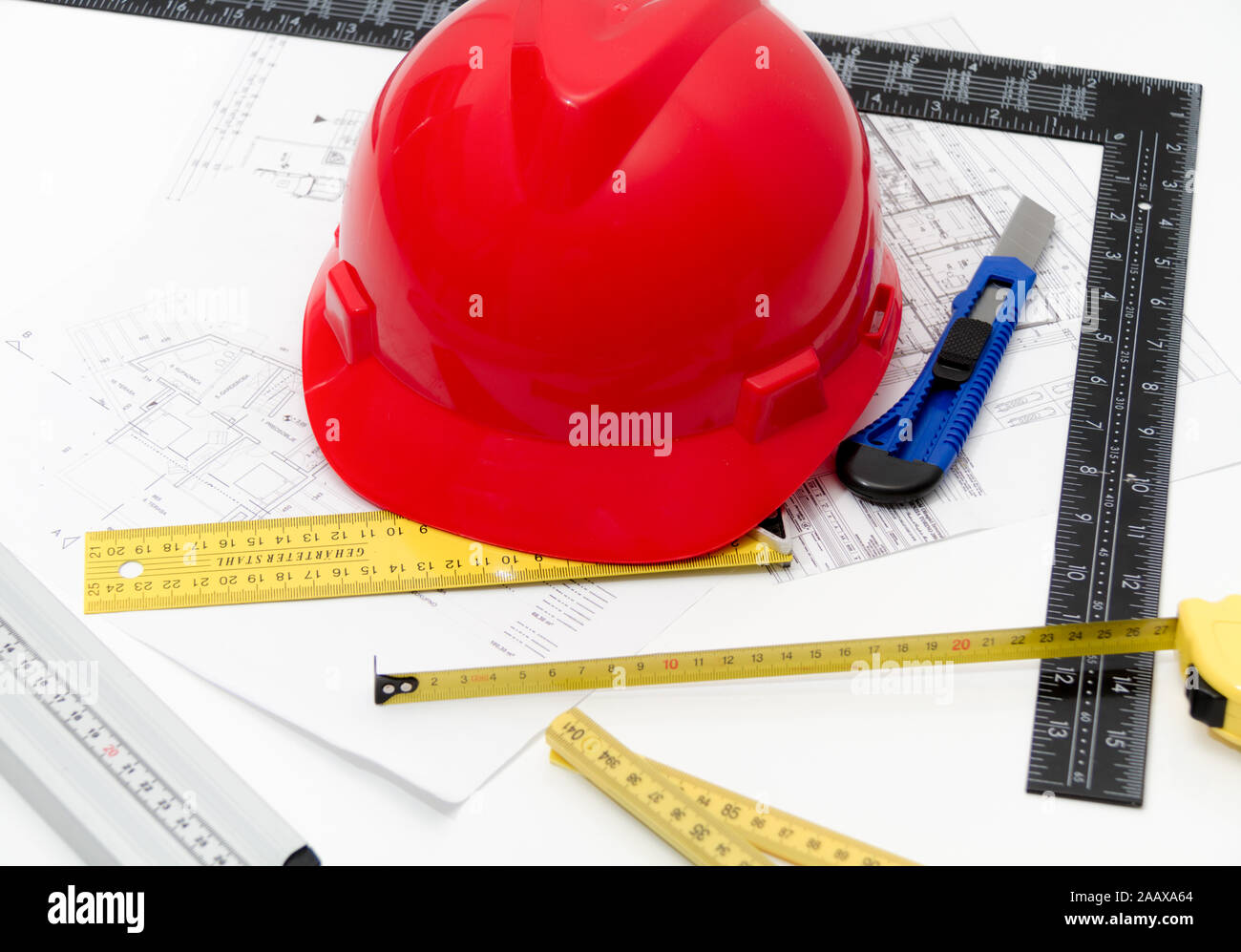 Photo of the Helmet and tools for construction drawings and buildings ...
