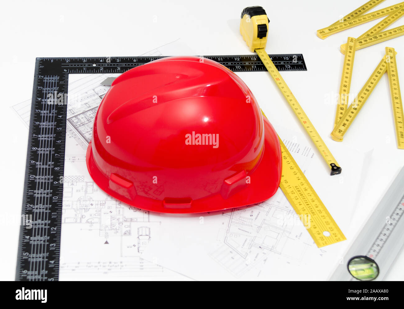 Photo of the Helmet and tools for construction drawings and buildings ...