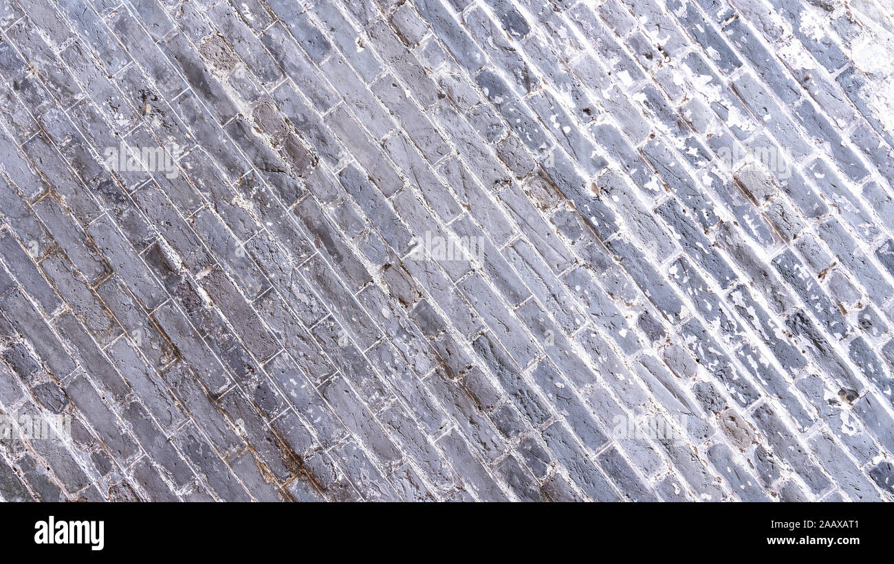 Real gray antique retro brick tone, pattern wall background in an old ...