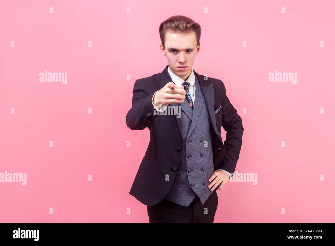 Hey you! Portrait of irritated bossy businessman in tuxedo pointing at ...