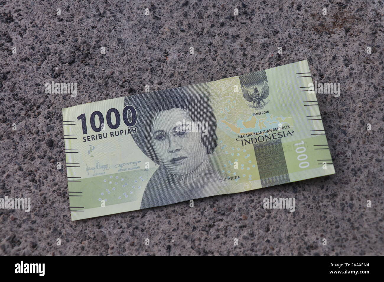 Indonesian rupiah currency notes in one thousand denomination isolated ...