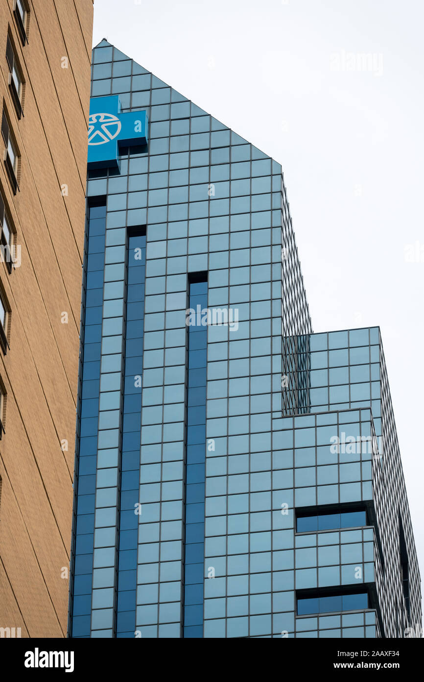 The blue glass curtainwall of the G Fred DiBona Jr Building contrasts ...