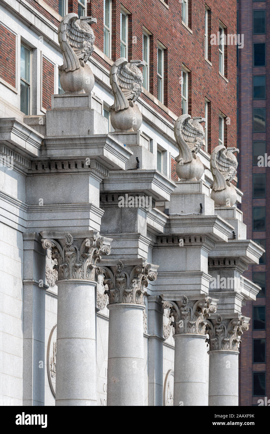 Corinthian stone columns topped by eagles on orbs, frame the entrance ...