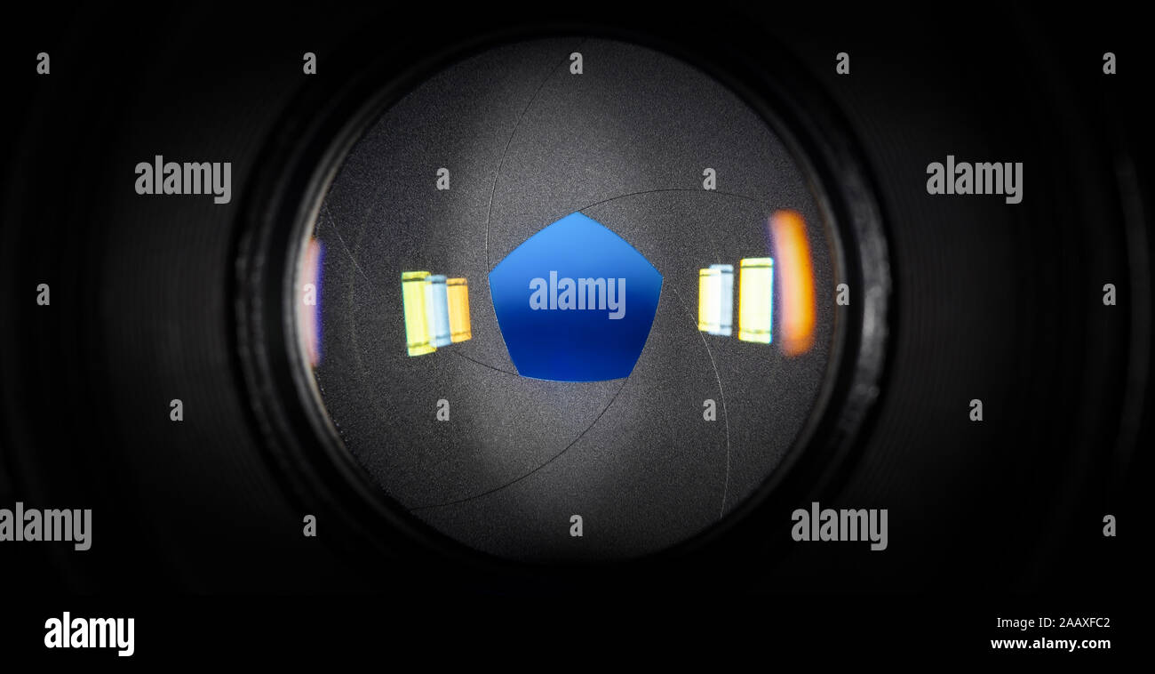 Five-blade aperture photographic lens with colored reflections, closeup ...