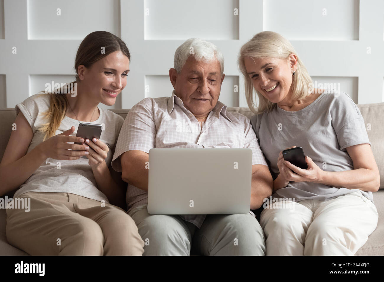 Addicted To Technology Happy Family Spending Free Time At Home Stock Photo Alamy addicted-to-technology-happy-family-spending-free-time-at-home-stock-photo-alamy