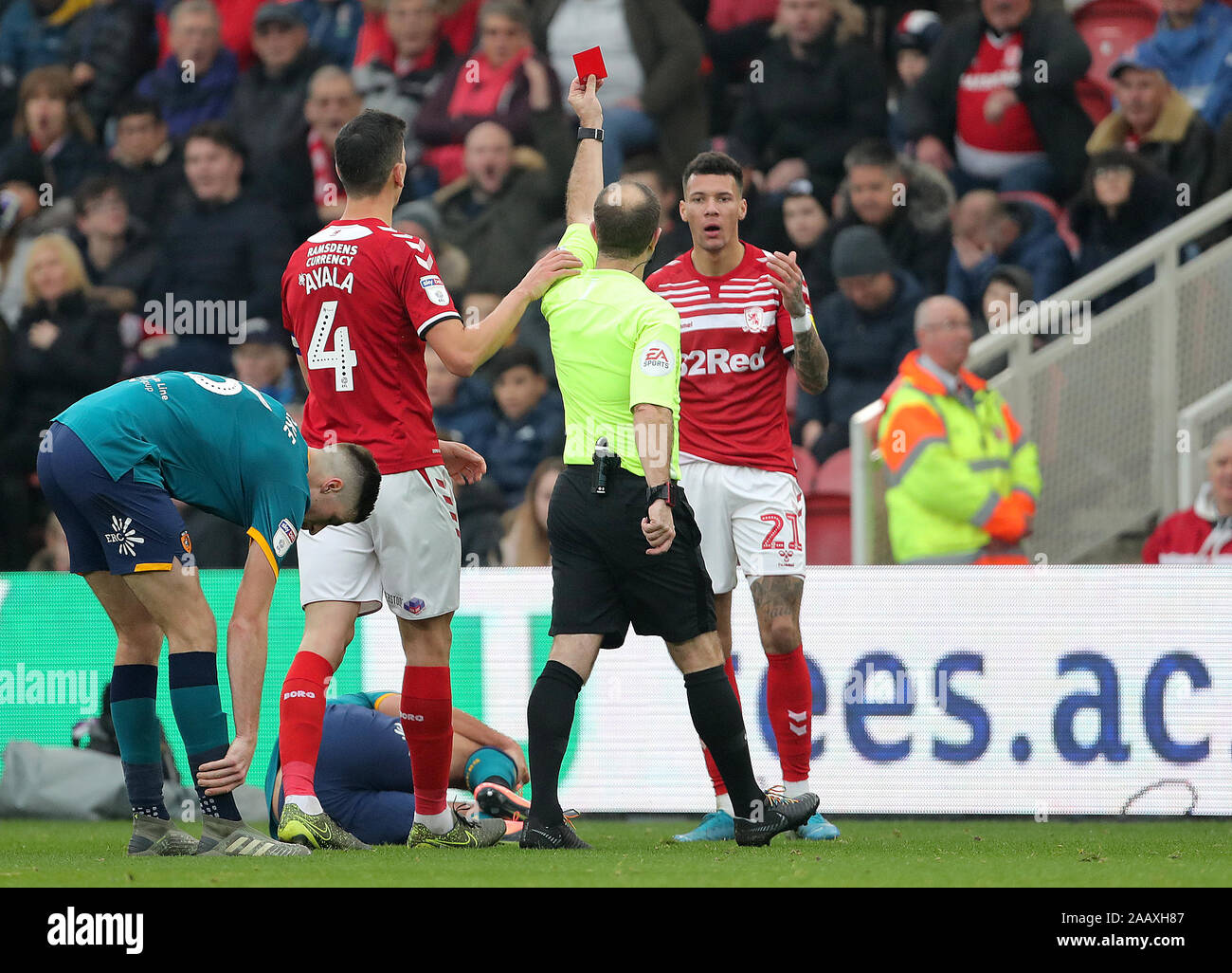 Middlesbrough's Marvin Johnson (right) is shown a red card by referee ...