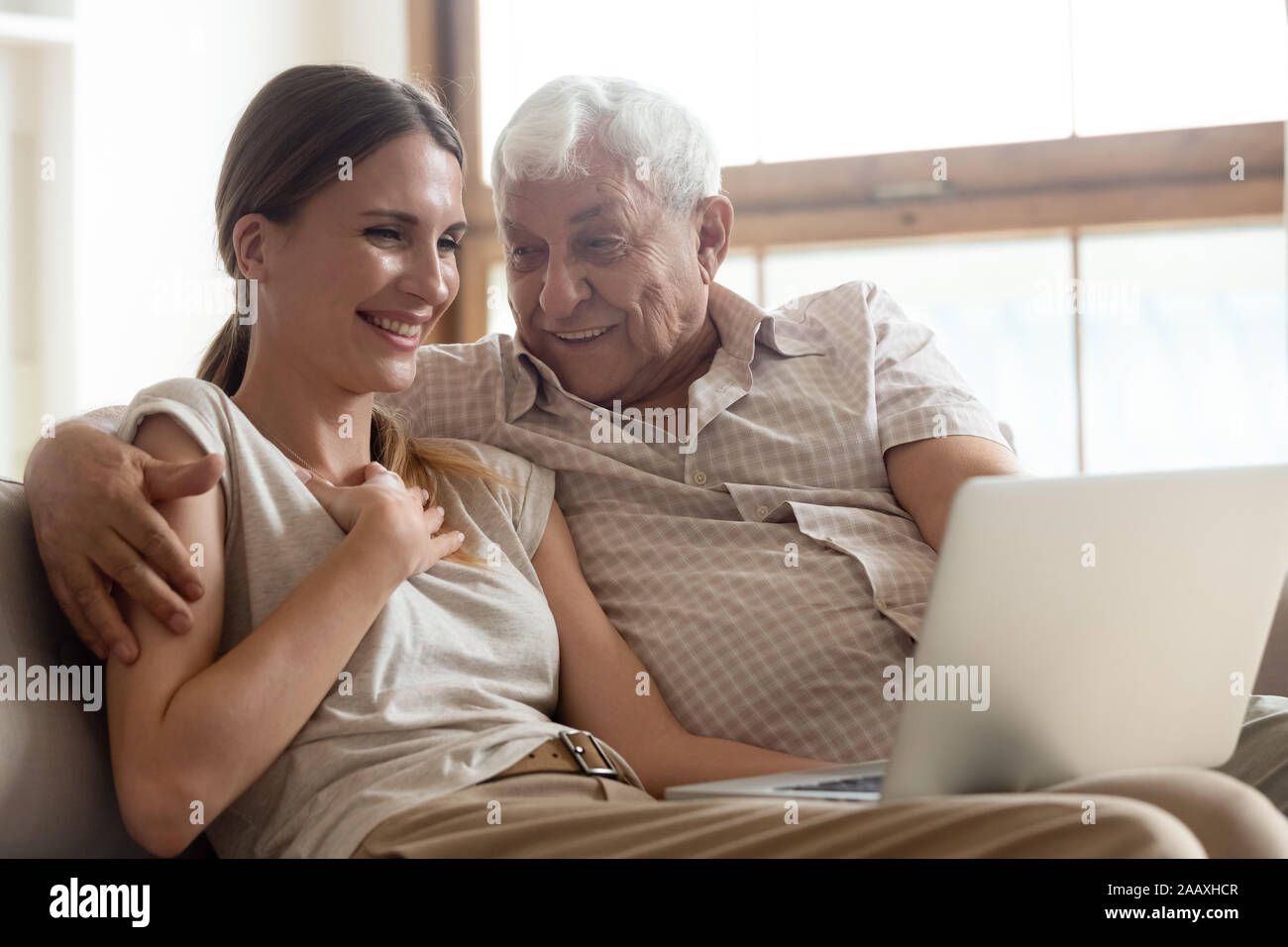 Joyful 2 generations family enjoying weekend time at home Stock Photo ...