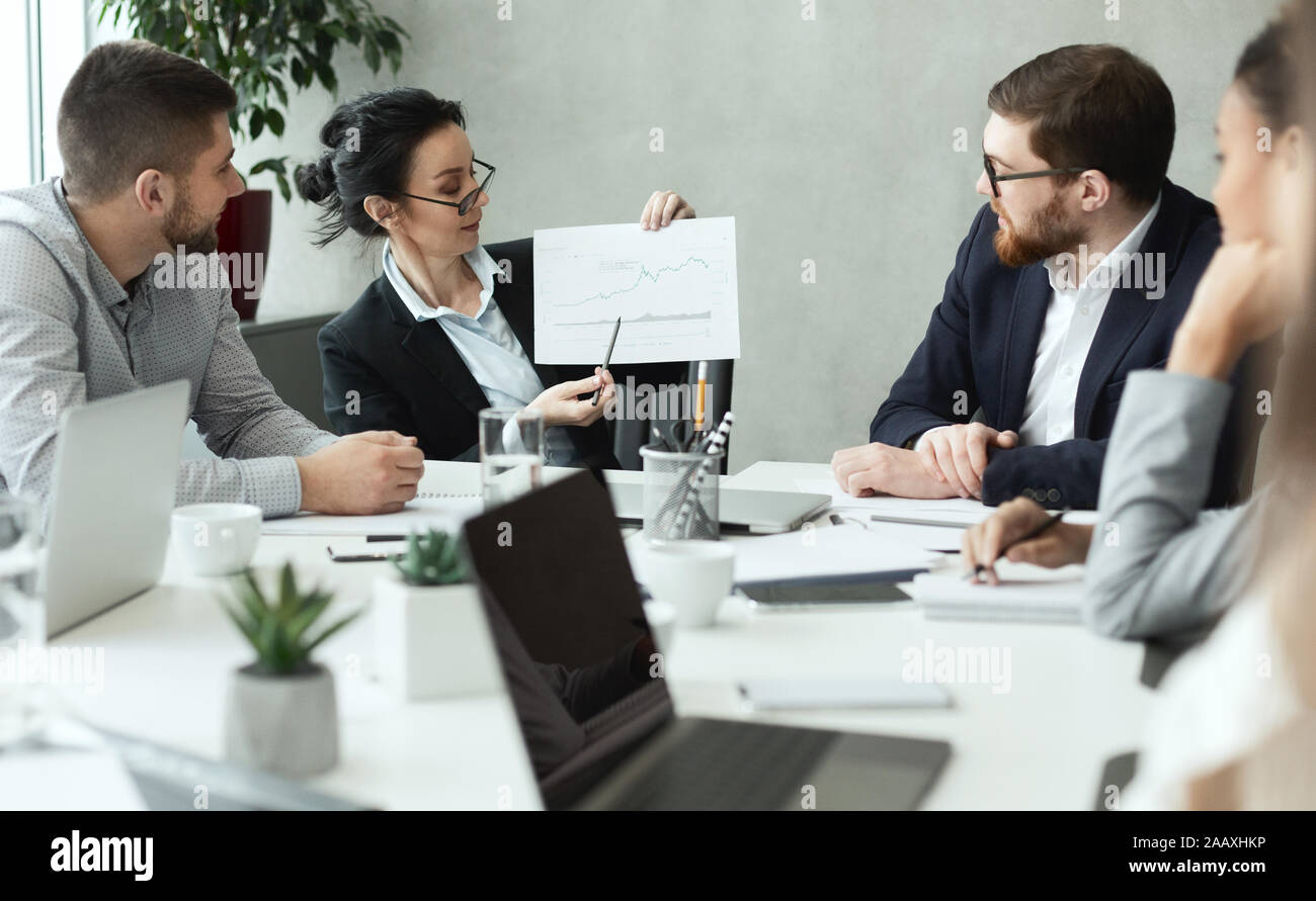 Ceo manager showing increasing financial chart on paper Stock Photo - Alamy