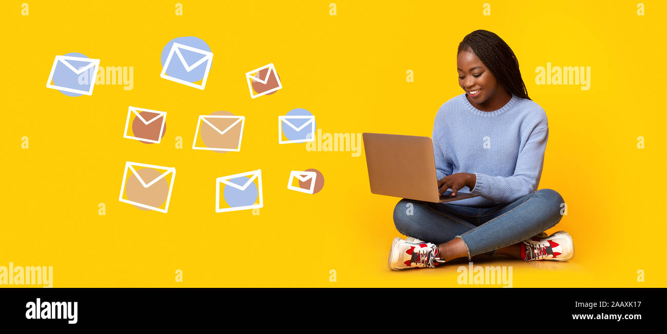 Woman typing text message on laptop, flying email envelopes Stock Photo ...
