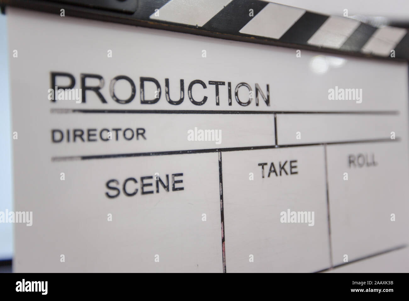 Movie clapper and editing room in background Stock Photo - Alamy