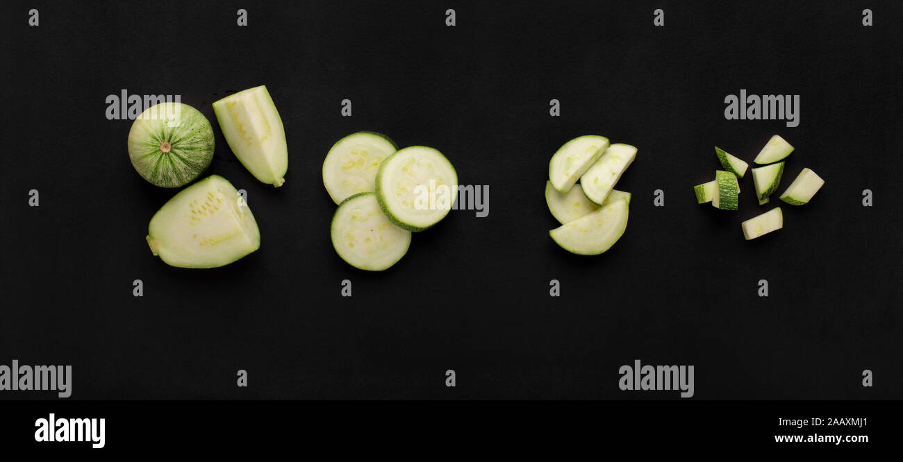 Squash cut into pieces of different shapes on black Stock Photo - Alamy