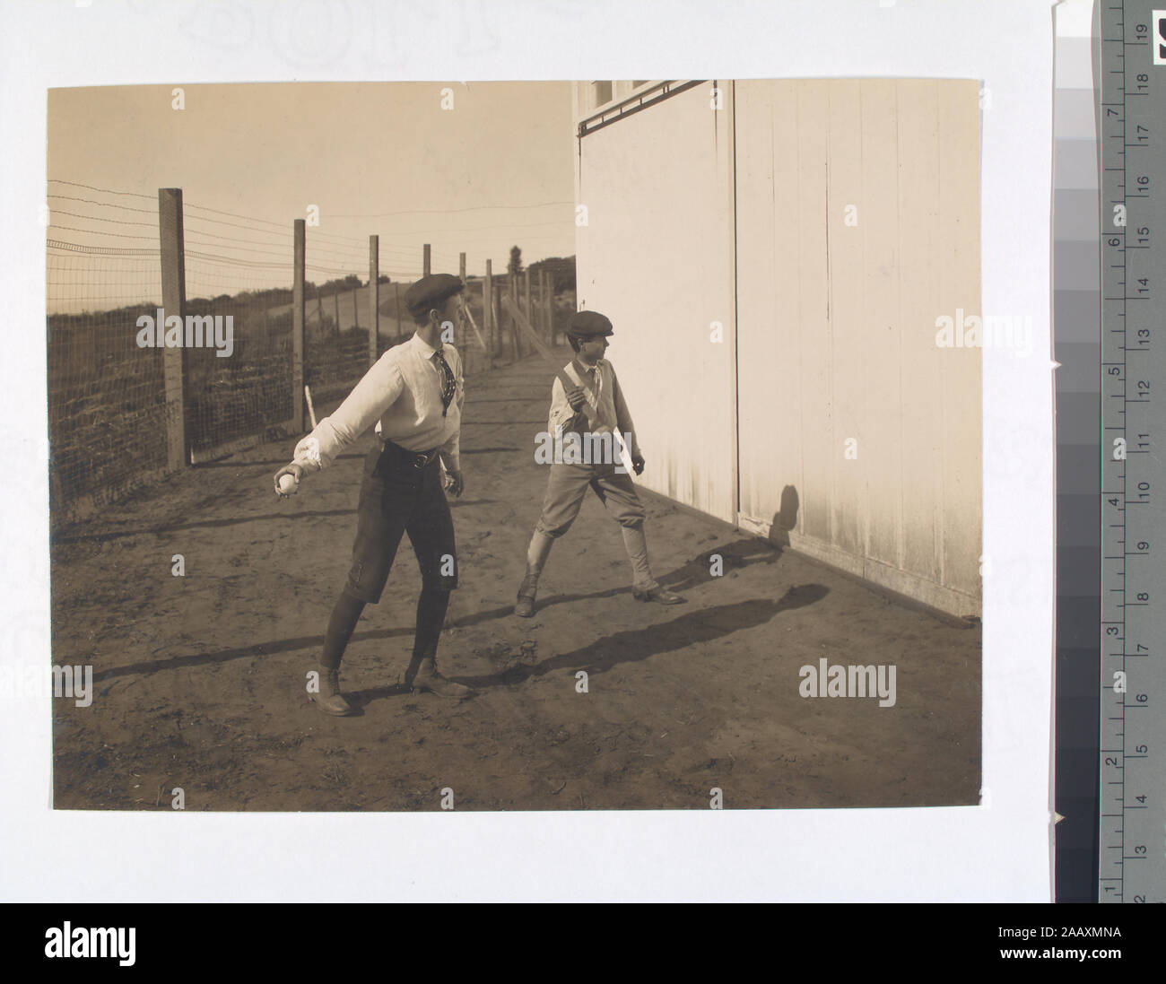 Fig 3- Two boys with a ball and bat, playing Barn Ball Fig. 3: Two boys ...