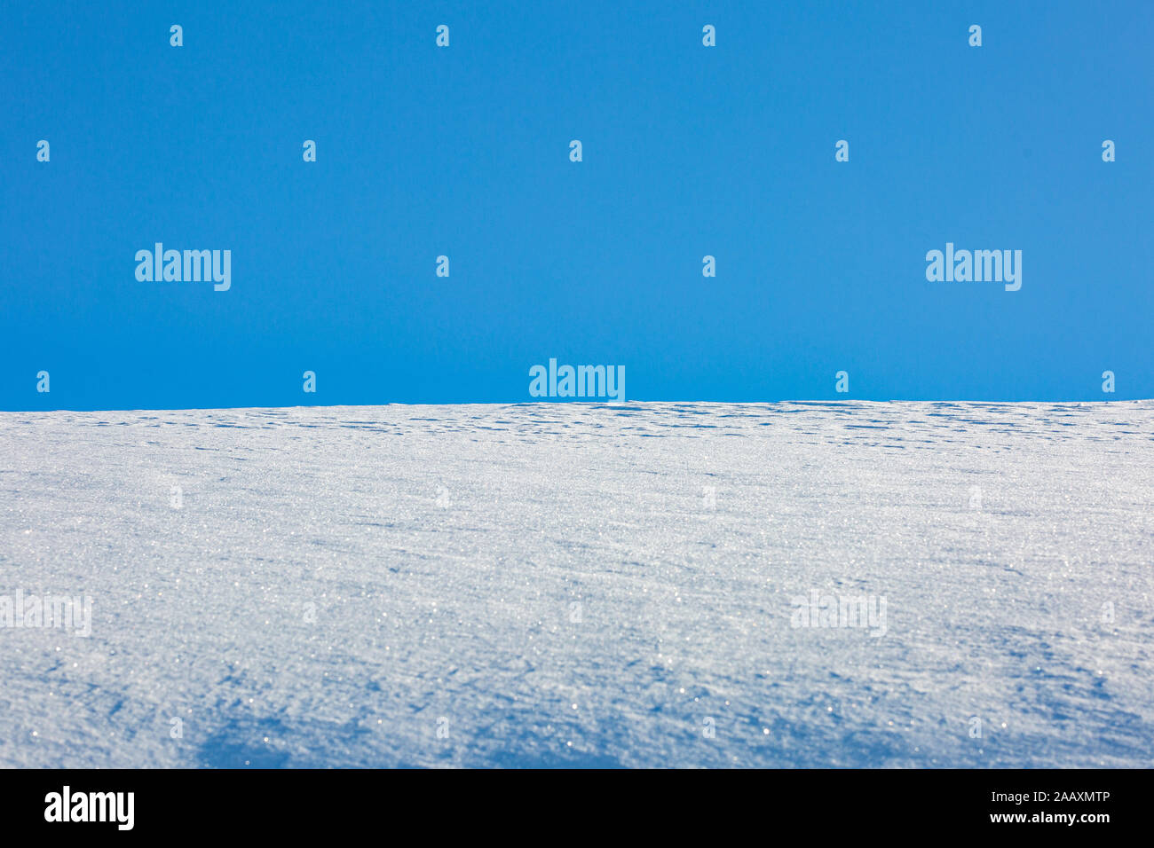 Snow drift patterns on background of blue sky Stock Photo - Alamy