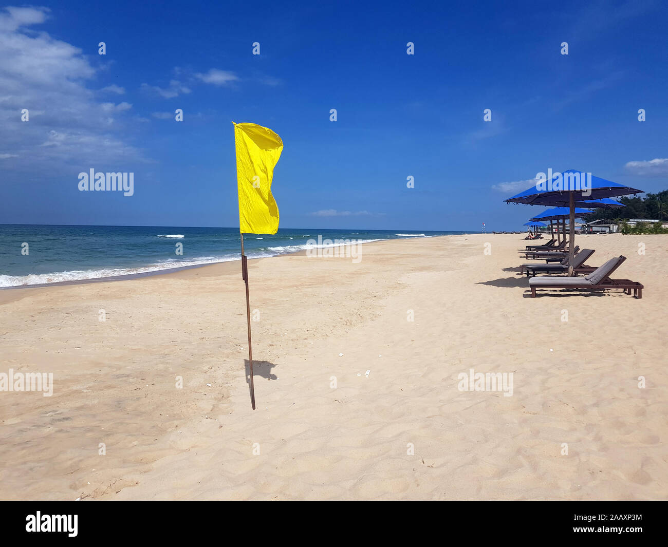 Yellow Safety Flag at Thuan An Beach Stock Photo - Alamy