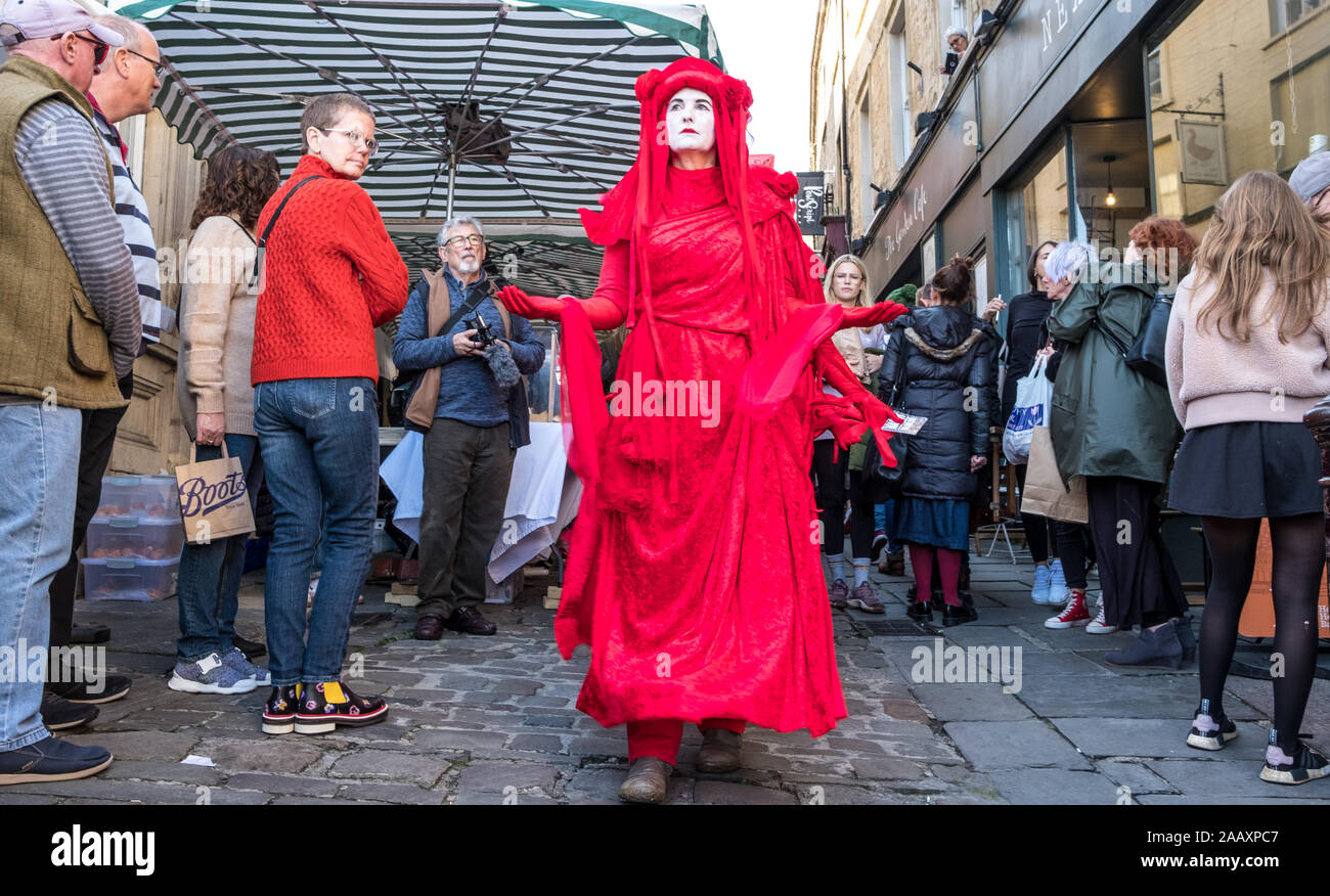 Red Rebels from Extinction Rebellion walk through Somerset Market Town ...