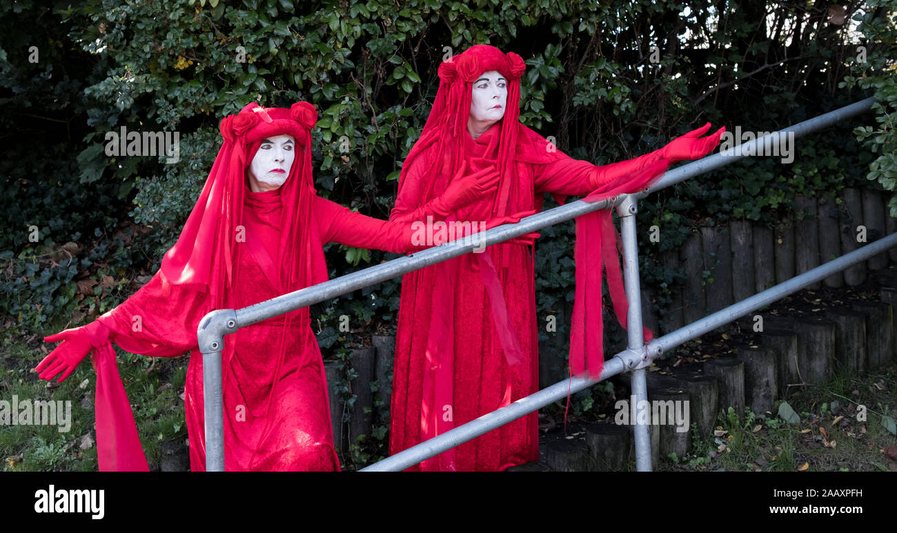 Red Rebels from Extinction Rebellion walk through Somerset Market Town ...