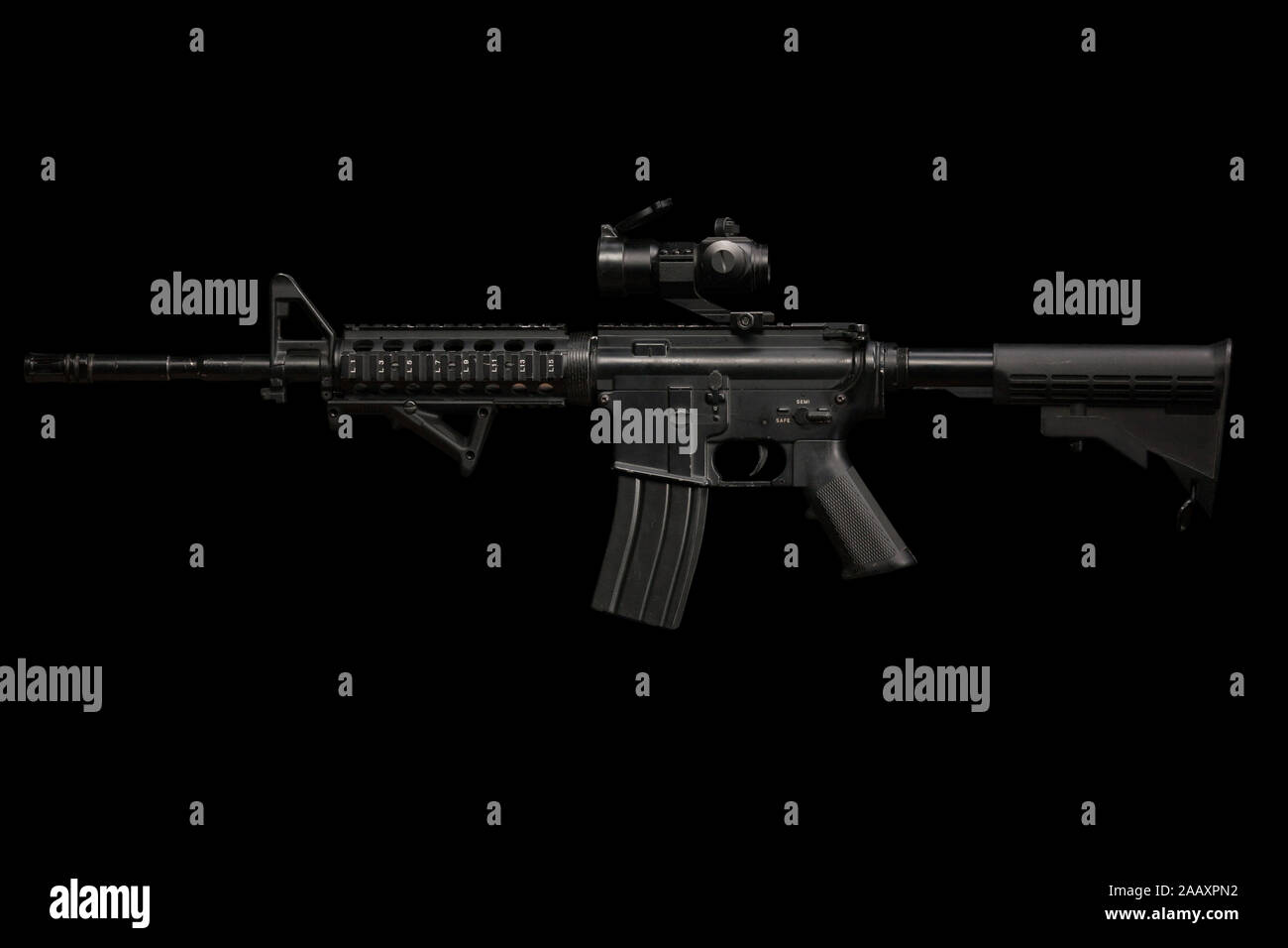 M4 assault rifle with optic sight isolated on black background Stock ...