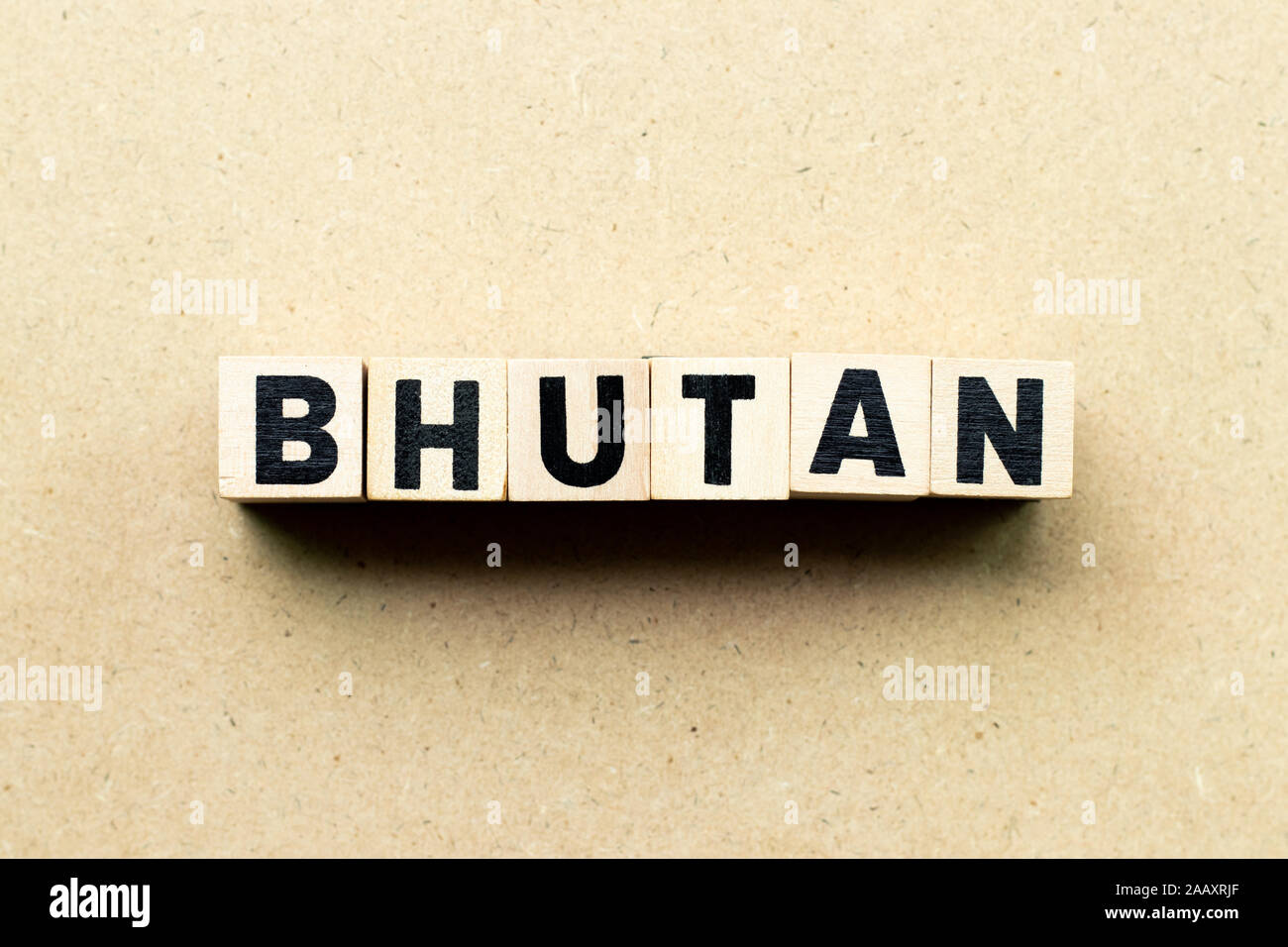 Letter block in word Bhutan on wood background Stock Photo - Alamy