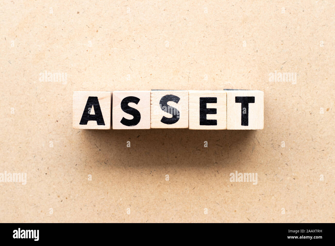 Letter block in word asset on wood background Stock Photo - Alamy