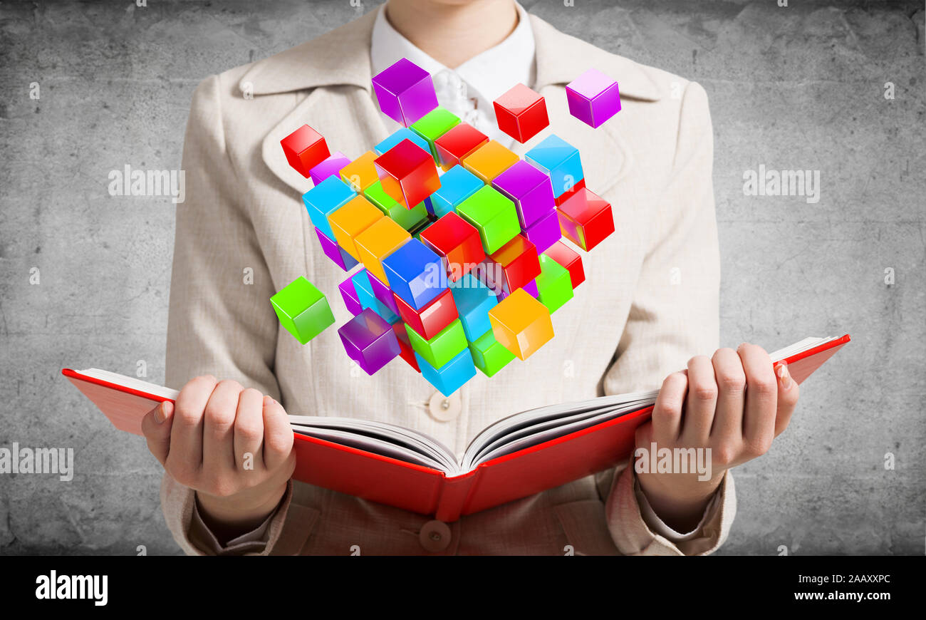 Woman showing colorful geometric 3d cubes Stock Photo - Alamy